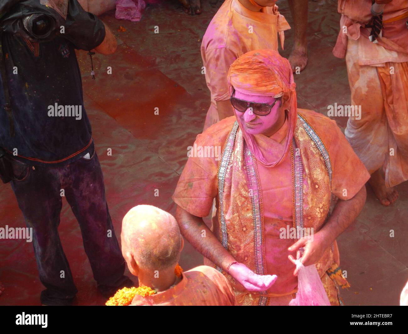 People covered with colors, celebrating the Holi Hindu festival in Lord ...