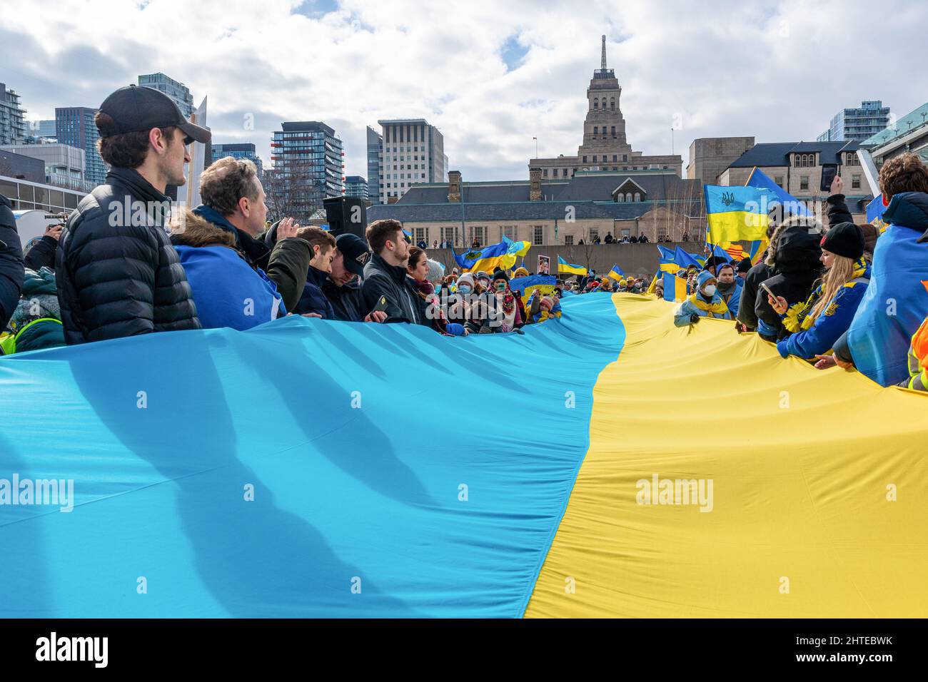 Toronto, Canada - February 27, 2022: A large Ukrainian flag held by a ...