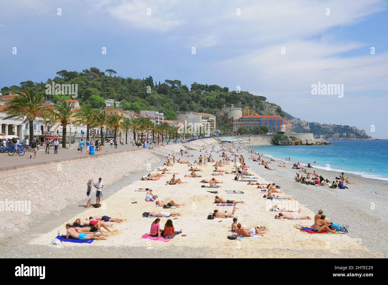 Nice, France - May 25, 2012: People rest on the beach at summer day ...