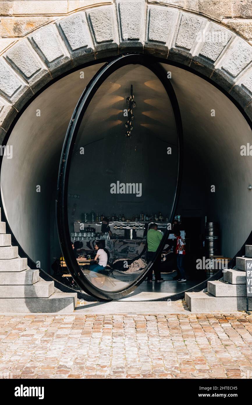 Restaurant with a circular glass door and tiled sideways to open and ...