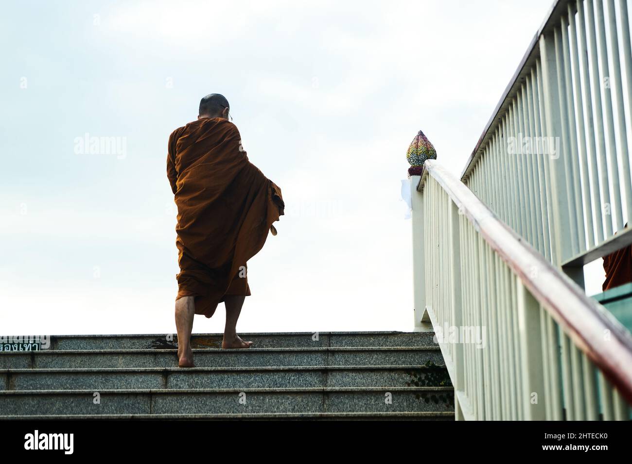 Monk walking up stairs hi-res stock photography and images - Alamy