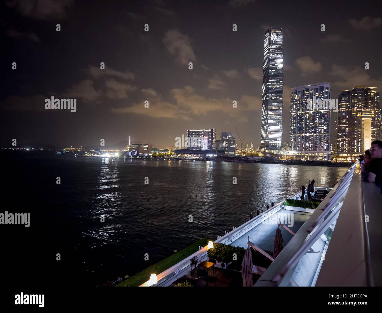 Beautiful view of the Tsim Sha Tsui district from the Victoria Harbour at night Stock Photo - Alamy