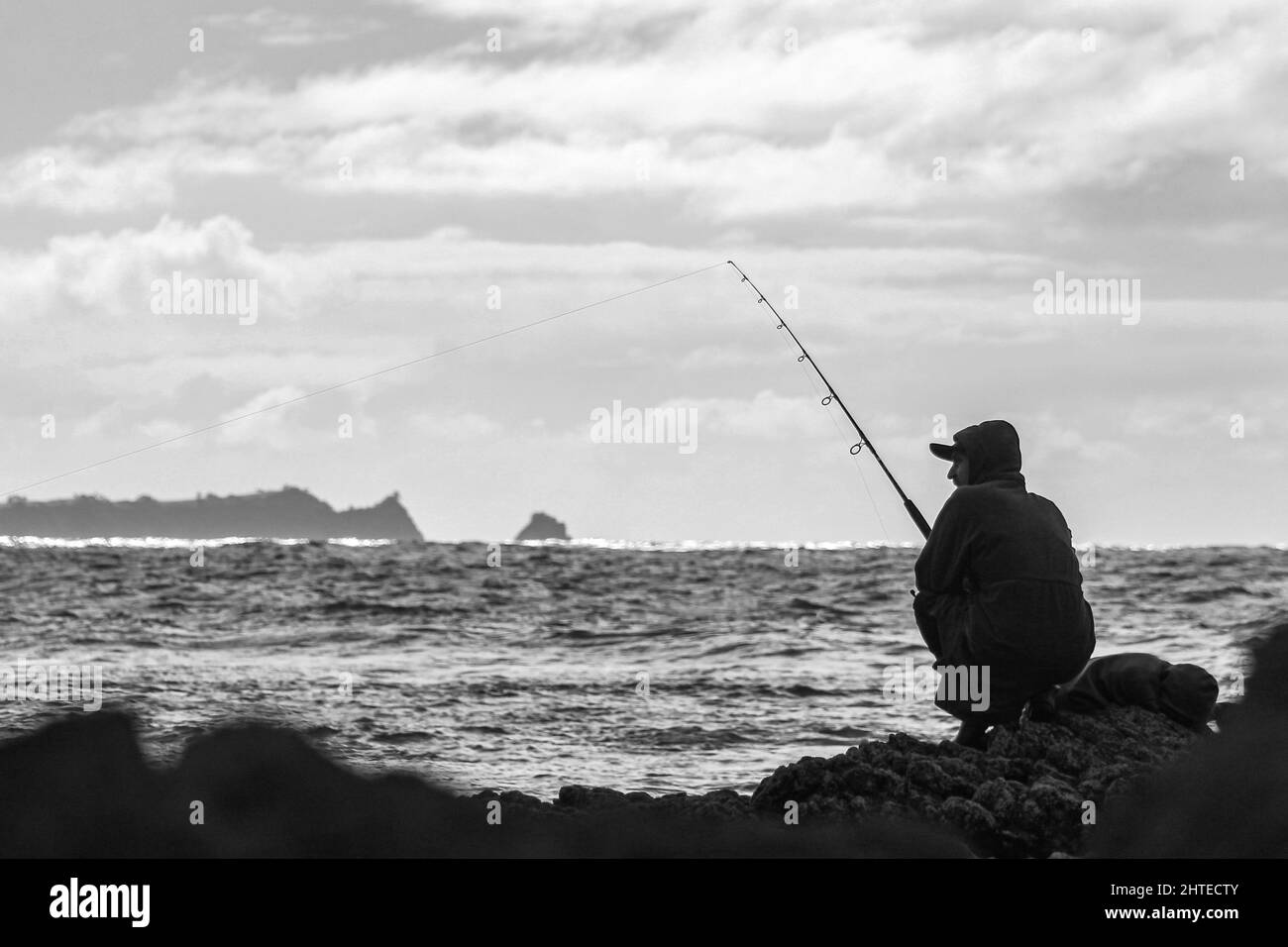 Catching fish from Black and White Stock Photos & Images - Alamy