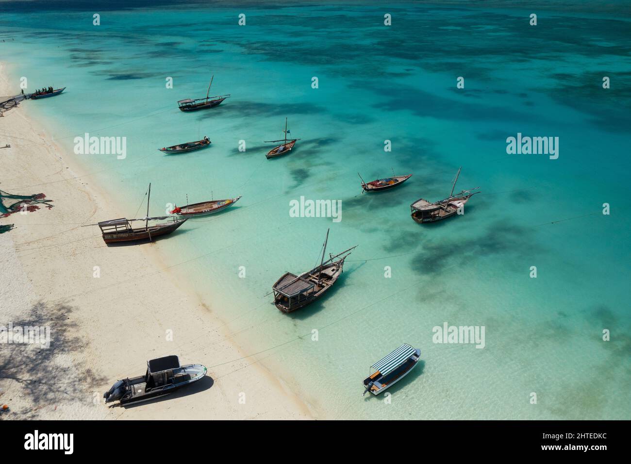 Small harbor with old fishing boats. Tropical colors of Zanzibar island ...