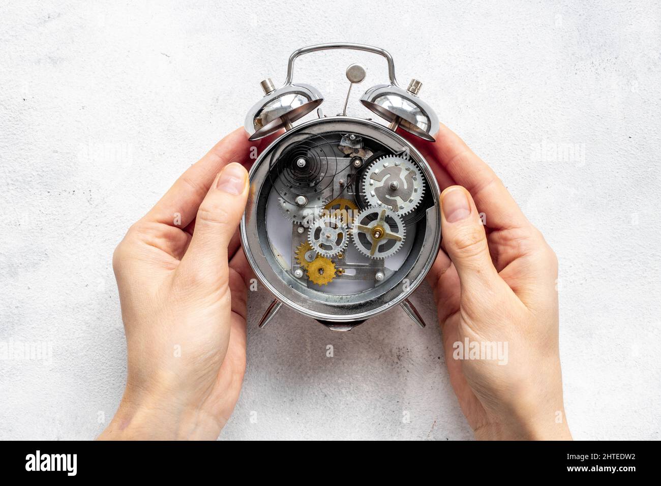 Open alarm clock with watch mechanism - steel gears and wheels closeup ...