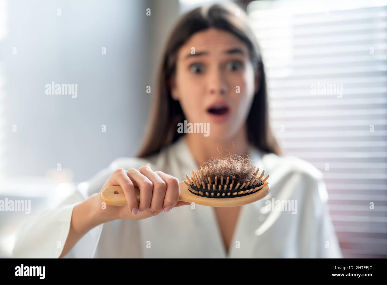 Shocked Female Holding Brush Full Of Fallen Hair, Worried About Hair ...