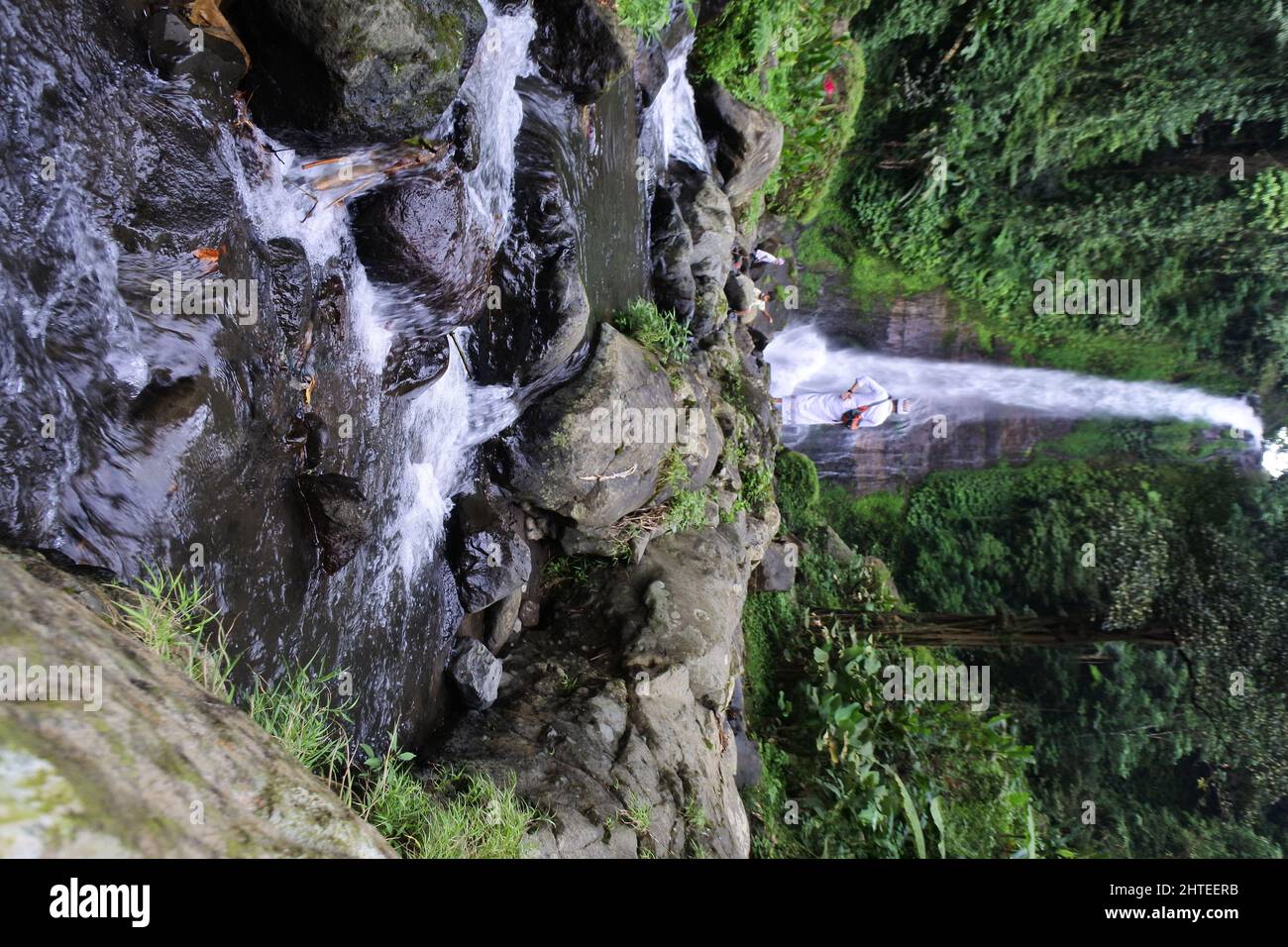 Beautiful landscape view of a high waterfall on a river with rocks and ...
