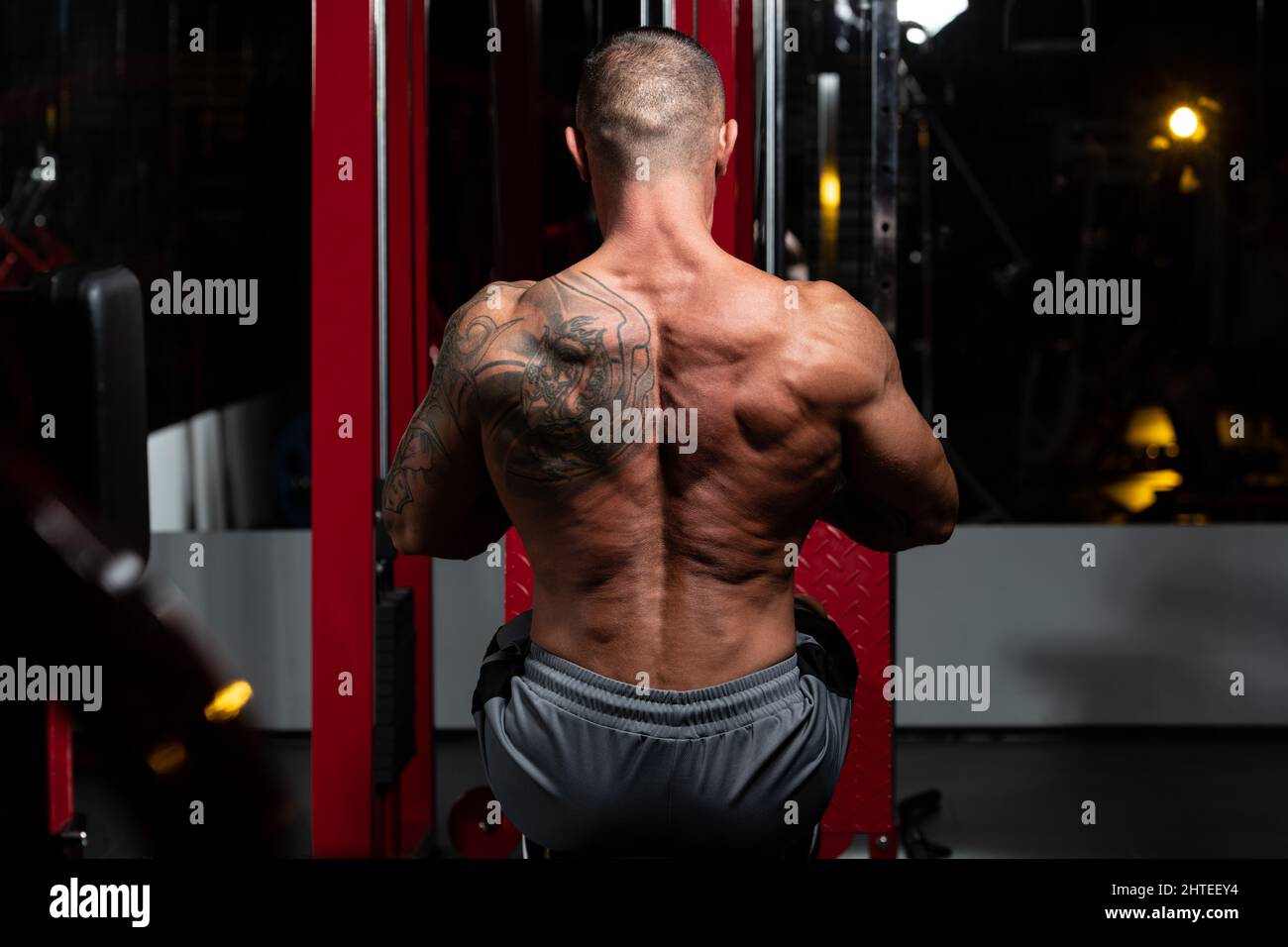 Muscular Man Doing Heavy Weight Exercise For Back Stock Photo - Alamy