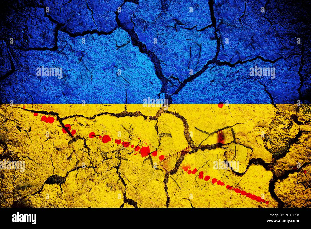 Cracked flag of Ukraine with red blood splatter on a yellow stripe as a ...