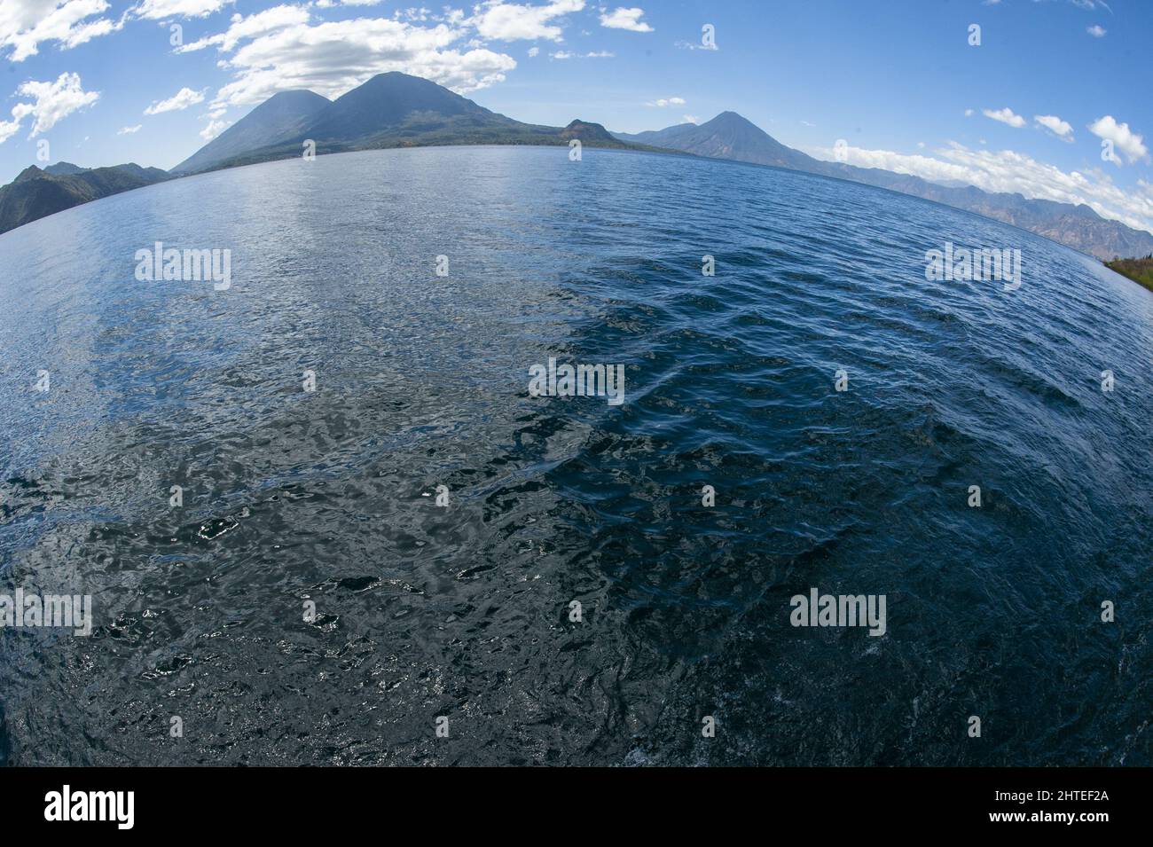 Lake Atitlan with Volcanoes as seen from Santa Catarina Palopo, Solola ...