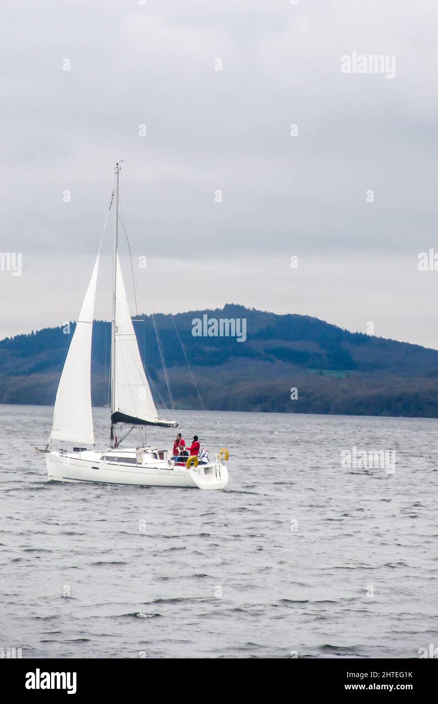 A Single mast Sailboat on Windermere Lake, in the Lake District, UK, on ...