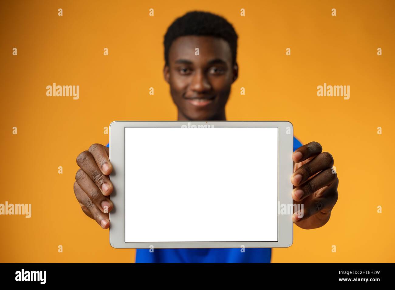 African american man showing blank digital tablet screen with copy ...
