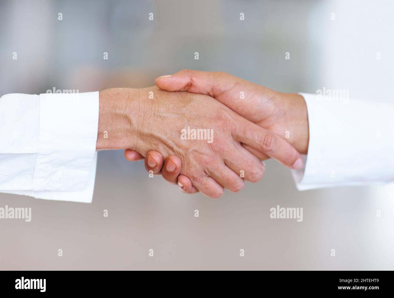 Business handshake between two men hi-res stock photography and images ...