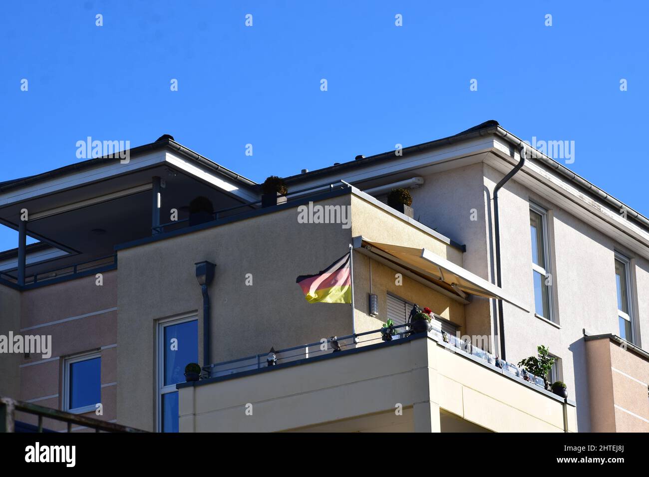 ragged German flag at a rather modern house Stock Photo - Alamy