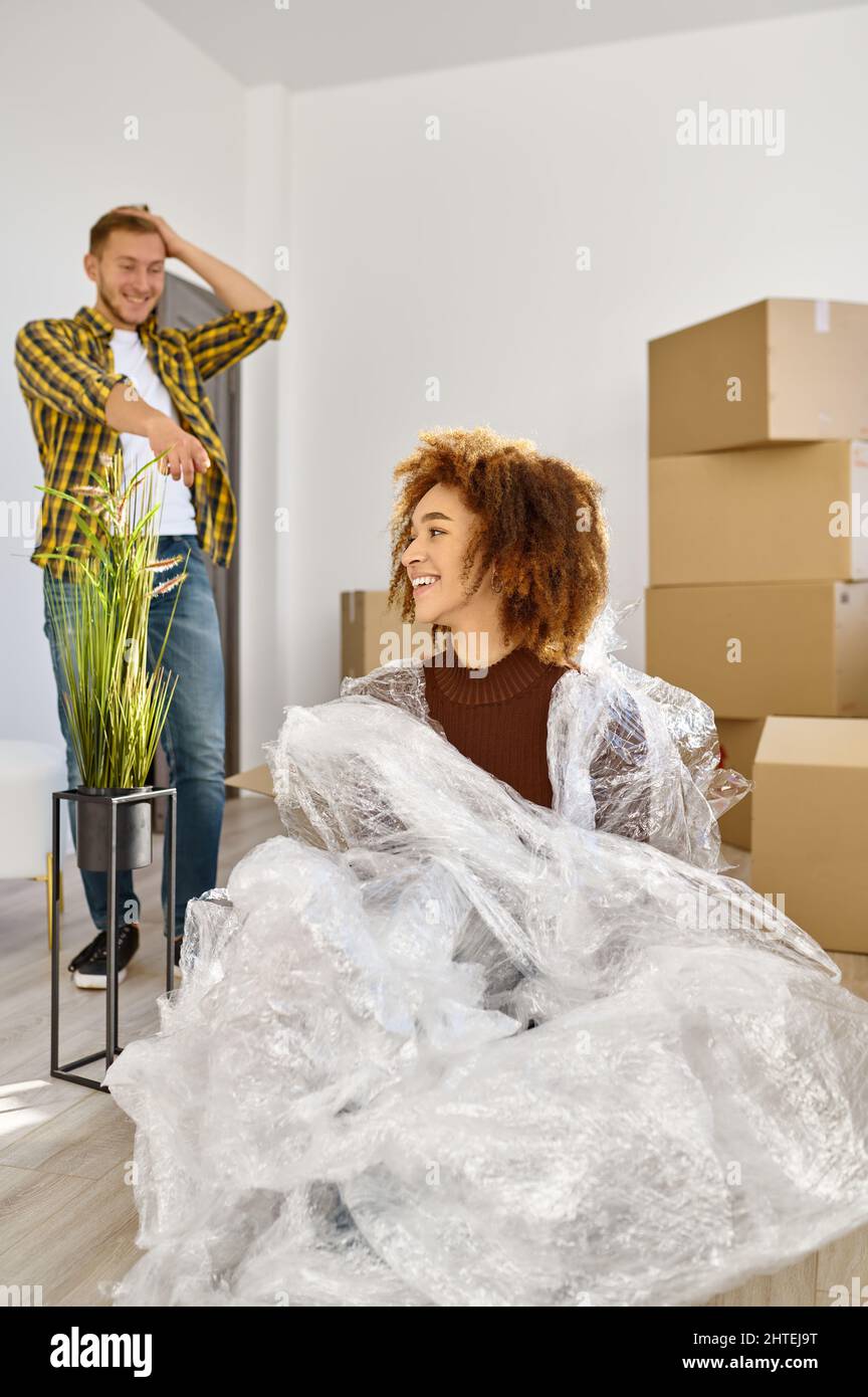 Woman wrapped in packing bubble tape portrait Stock Photo - Alamy