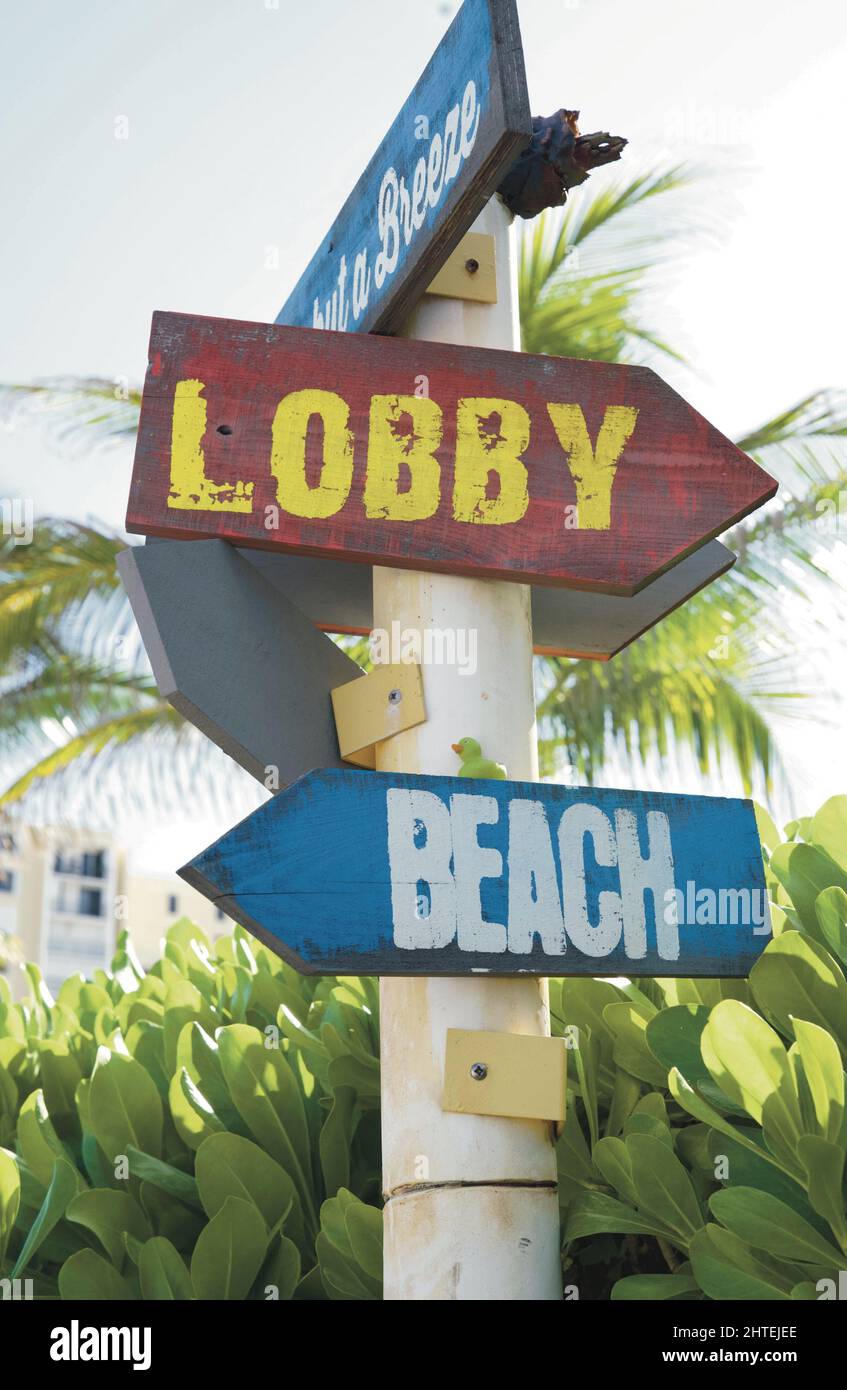 Vertical shot of beach signs with arrows Stock Photo - Alamy