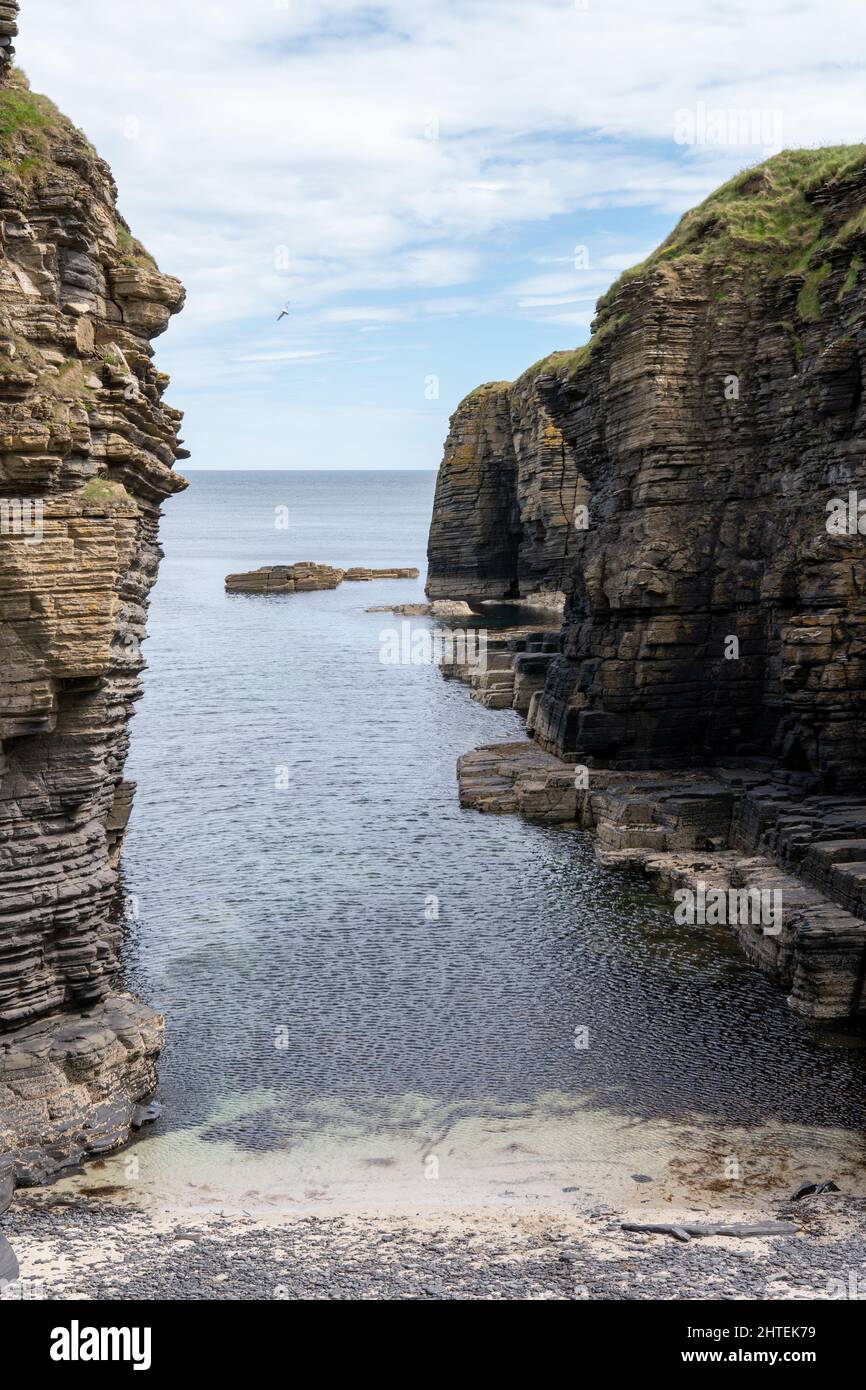 Portrait of beautiful cliff formations by the sea Stock Photo - Alamy