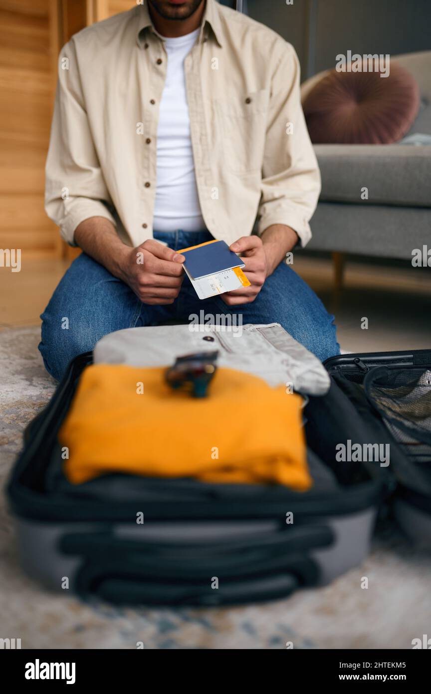 Suitcase clothes passport ticket hi-res stock photography and images ...