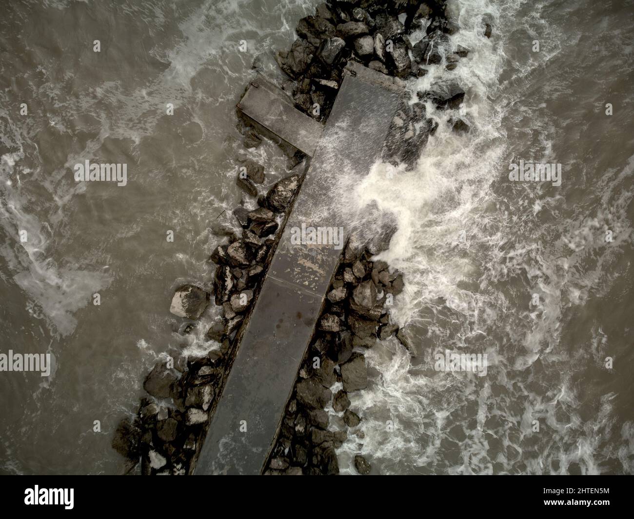 Aerial view of a mole with high waves Stock Photo - Alamy