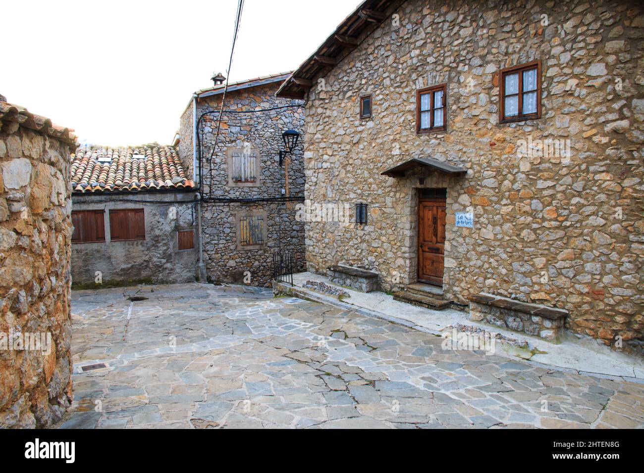 Scenic view of old town buildings with paved streets, benches, a ...