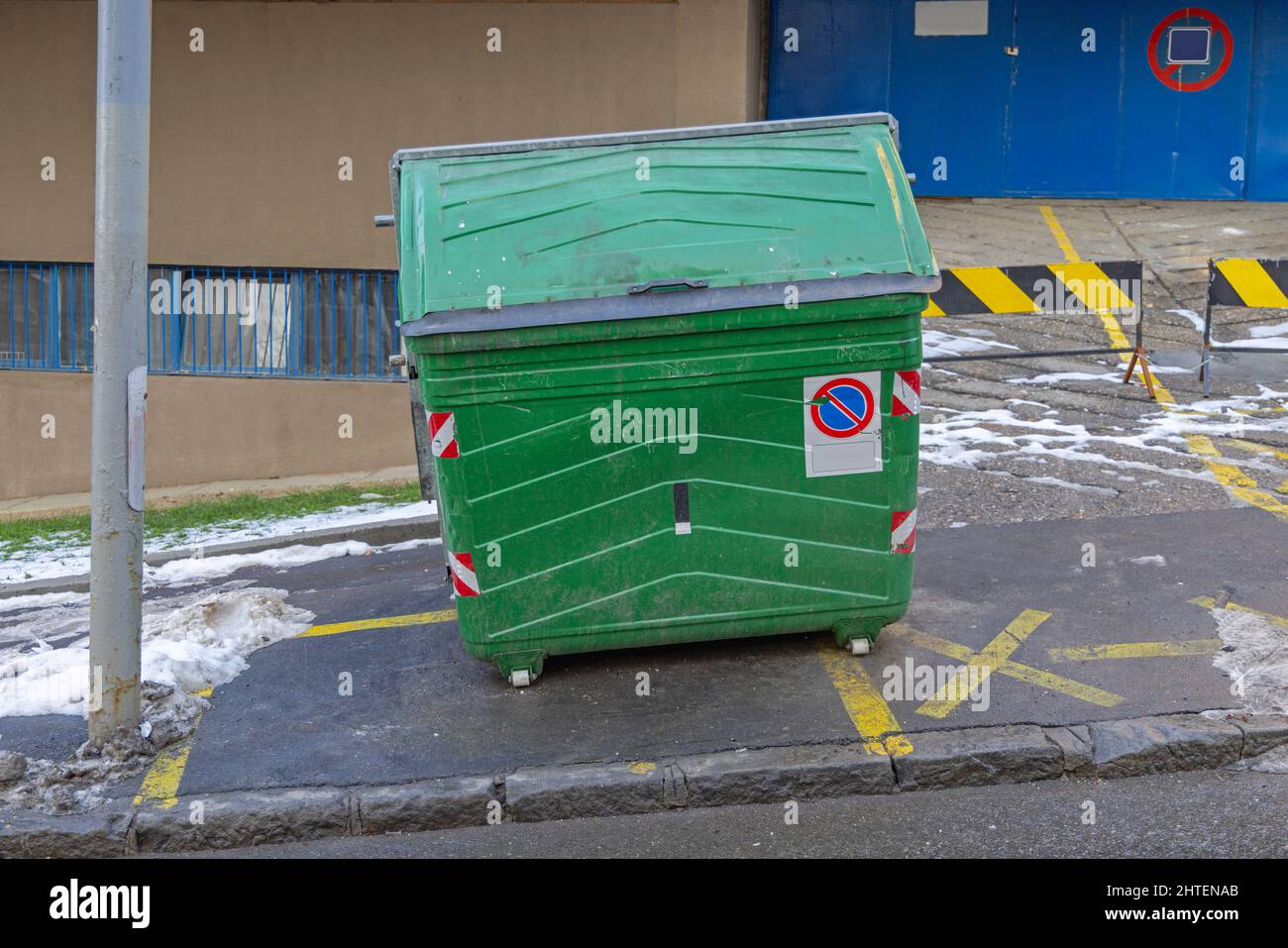 Big Green Dumpster Bin at Slope Street Stock Photo - Alamy