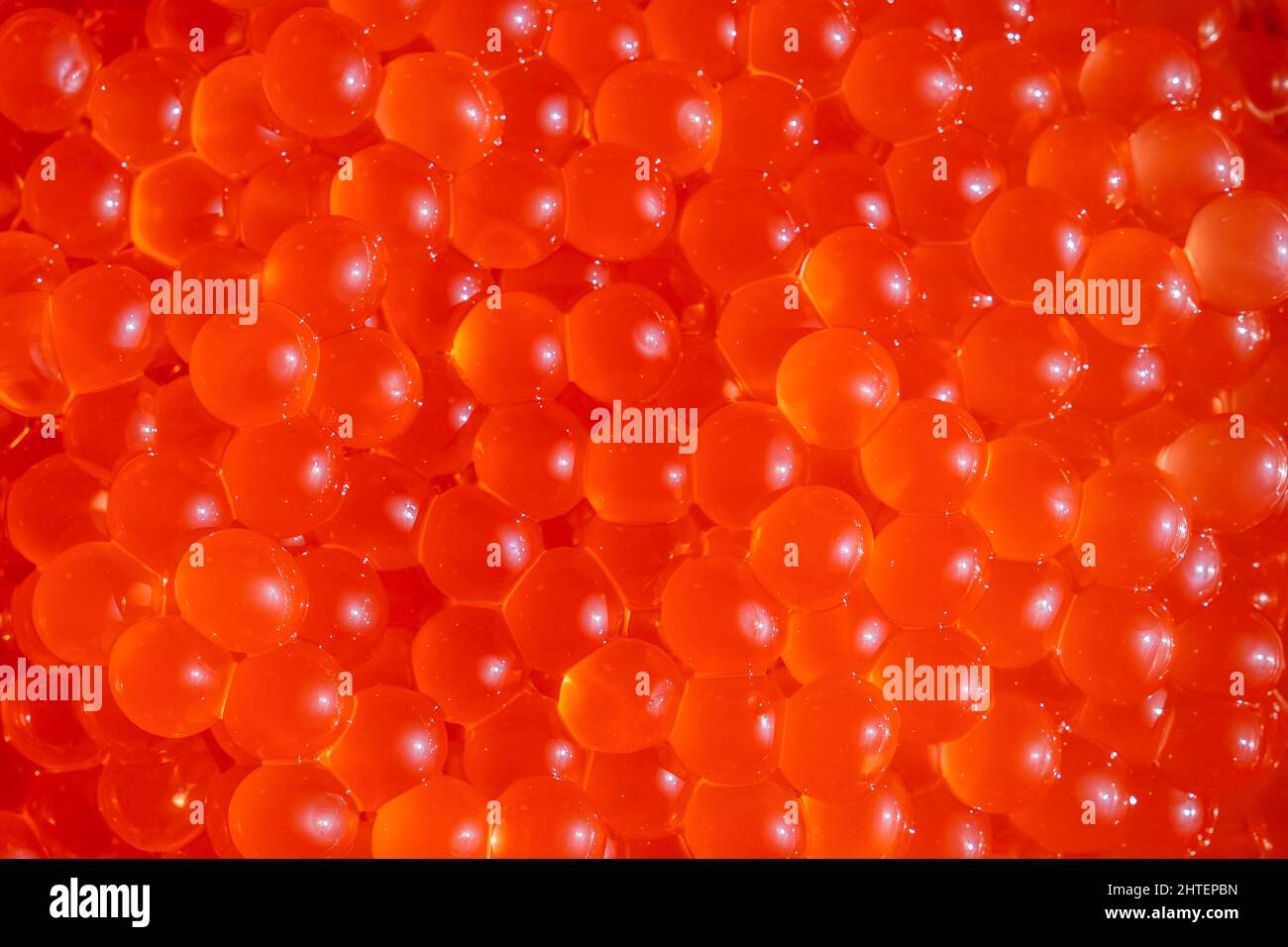 Top view of a bunch of red bobas with a flavor of pomegranate ...