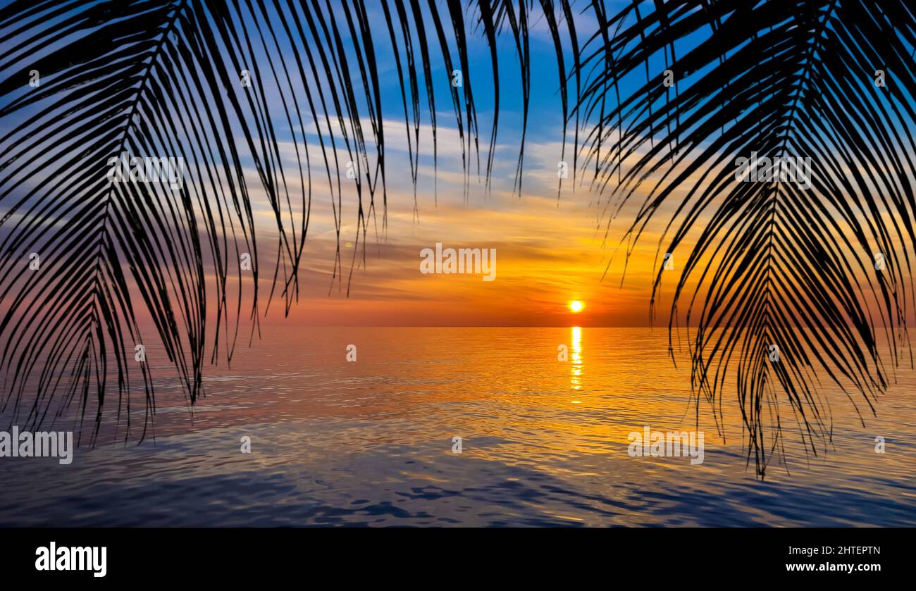 Beautiful sunset at a beach resort in the tropics Stock Photo - Alamy