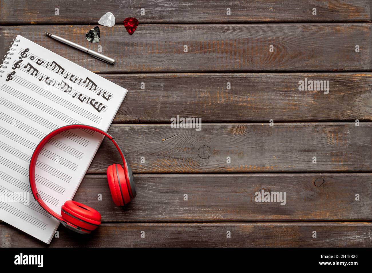 Sheets with music notes and headphones. Compose music concept Stock ...