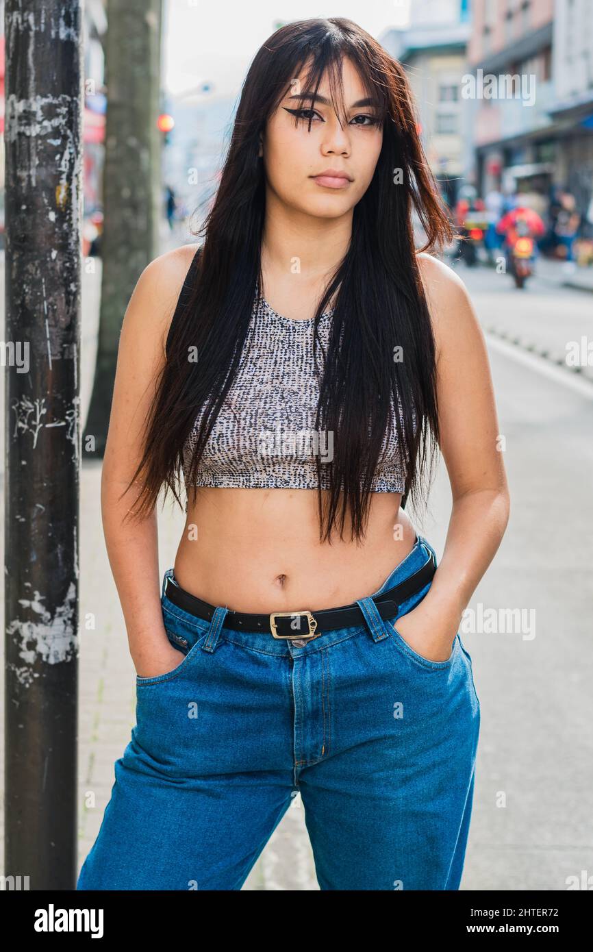 Beautiful Latina Girl With Brown Skin Posing Very Serious For The Camera And Focused On The 0997