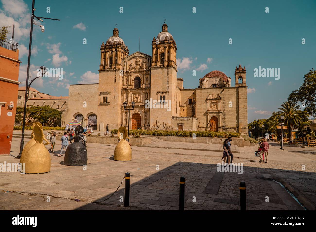 Pedestrians in front of Santo Domingo de Guzman temple Stock Photo - Alamy