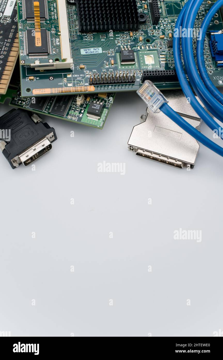 piled up computer and peripherals electronic boards on a white ...