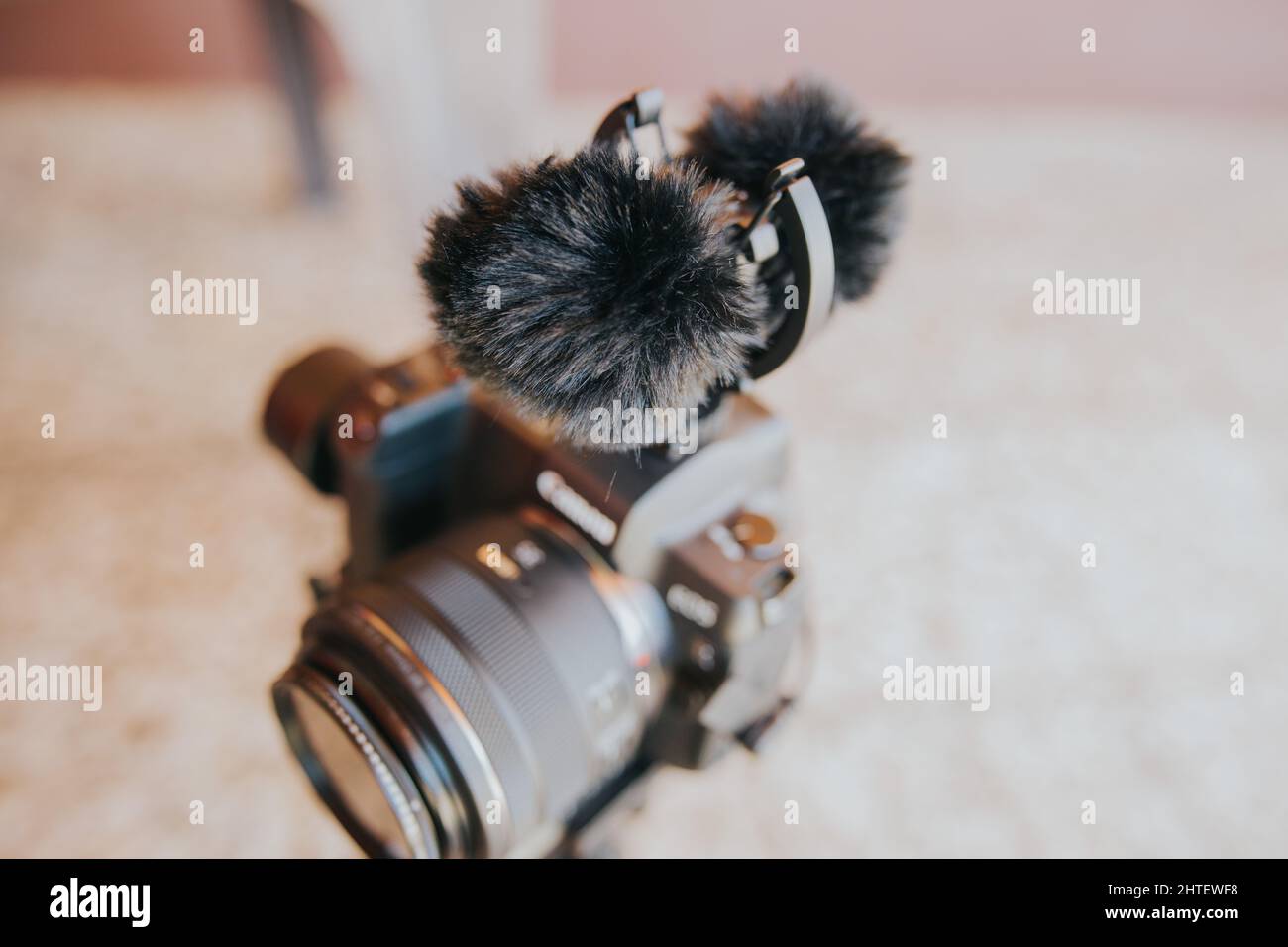 Shallow focus shot of a Canon EOS R camera on a gimbal with shotgun ...