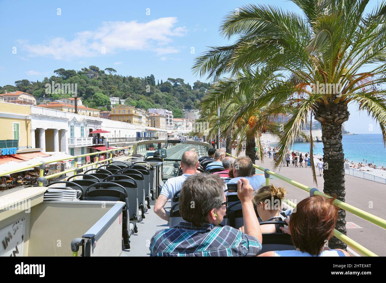 Nice, France - May 25, 2012: Bus with tourists moves along the beach ...