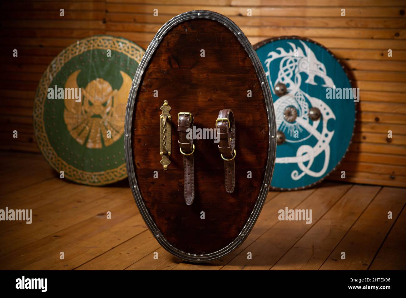 Three wooden medieval shields in a room Stock Photo - Alamy