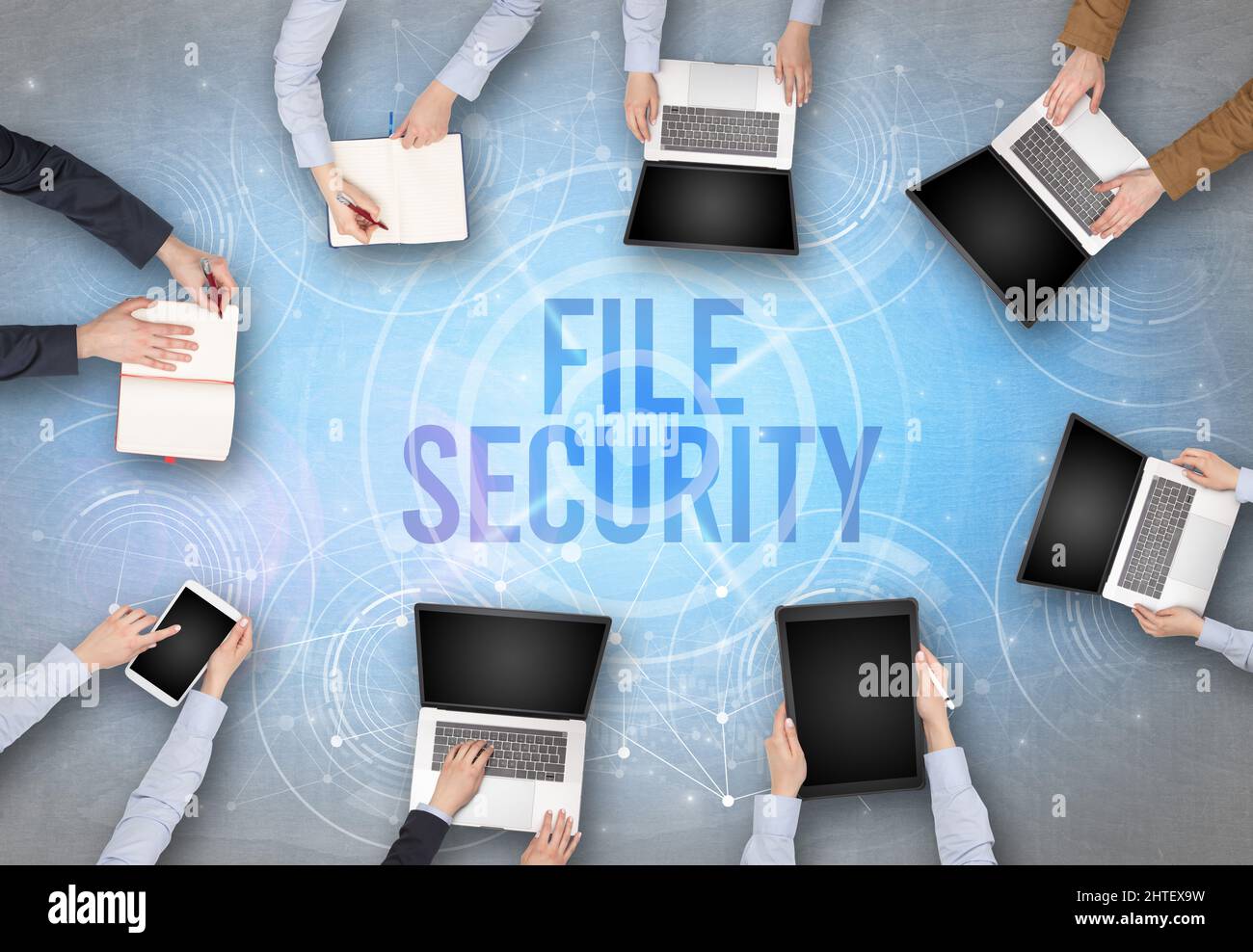 Group of people in front of a laptop, security concept Stock Photo - Alamy