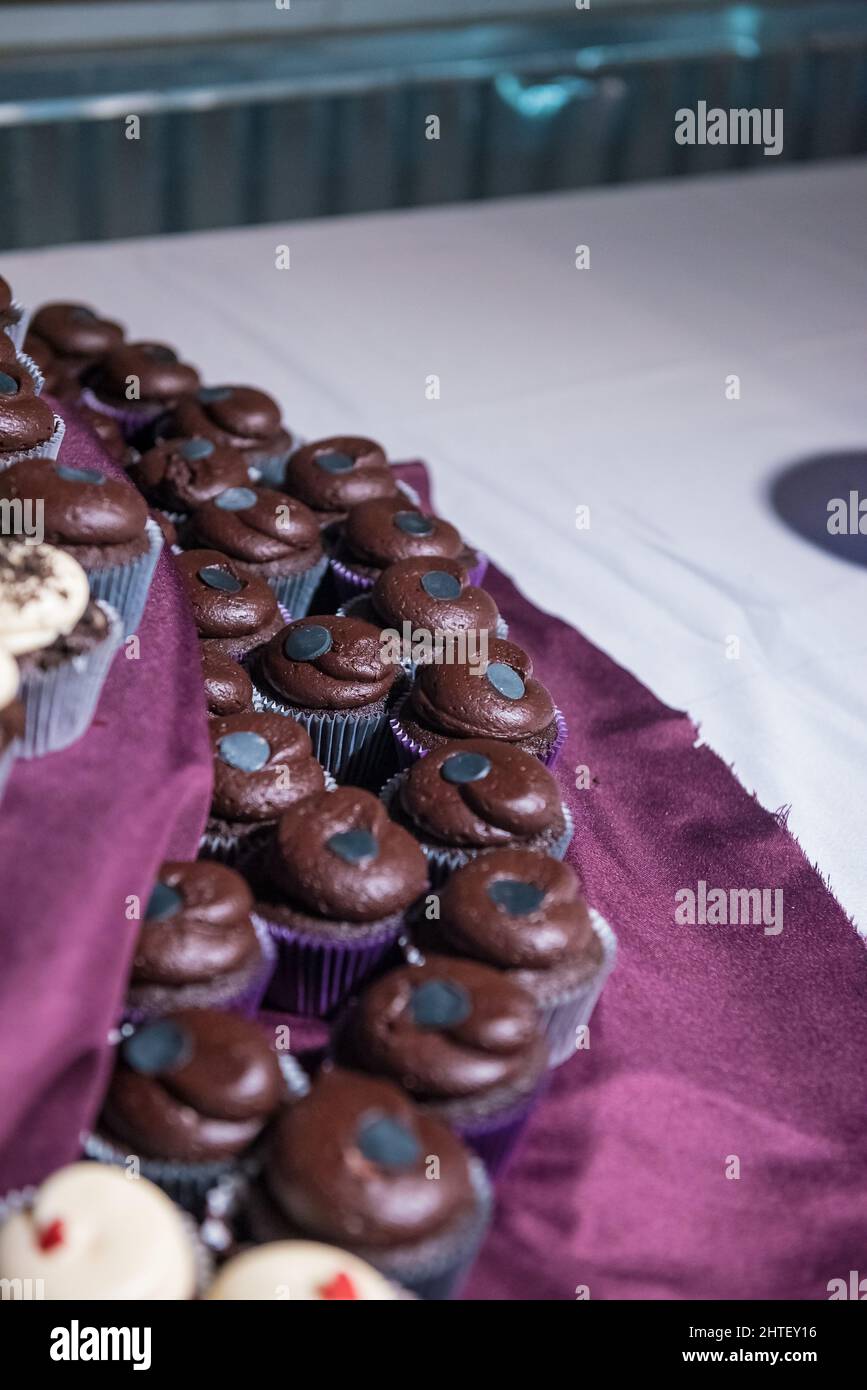 Vertical shot of many sweet cupcakes with chocolate decorations Stock ...