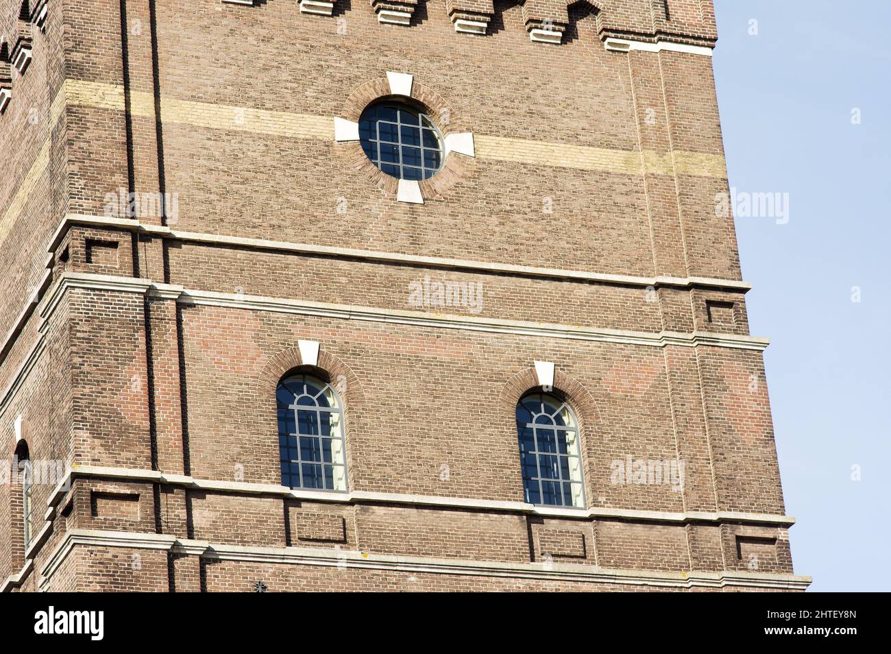 Facade of a modern tower with a medieval appearance in the center of ...