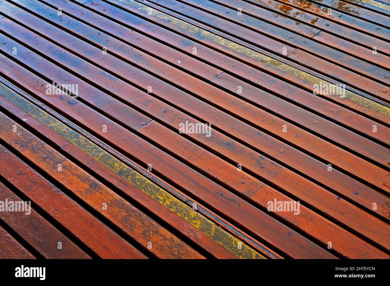 Wet wooden deck after rain Stock Photo - Alamy