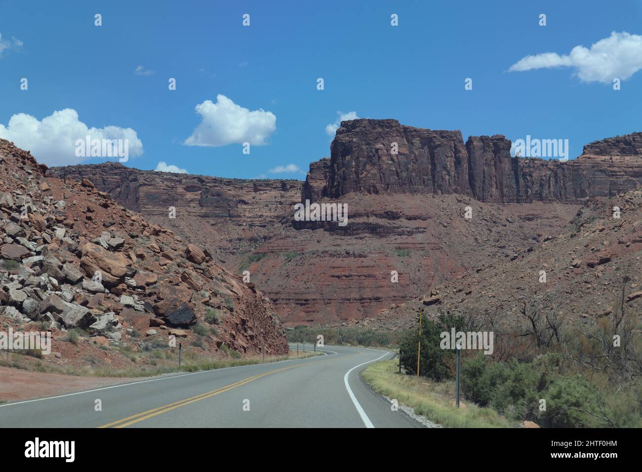 Asphalt road surrounded by rocky cliffs Stock Photo - Alamy