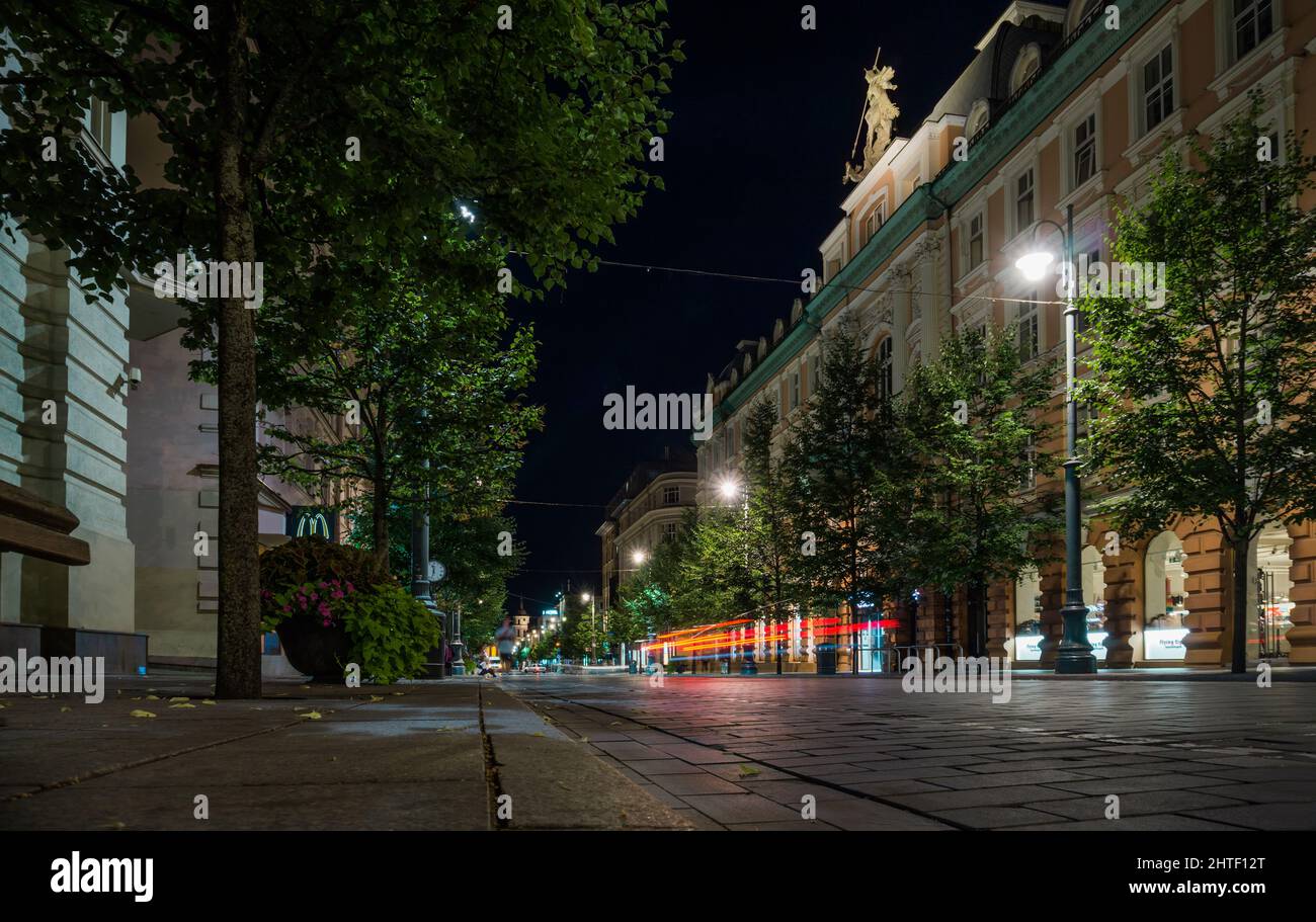 Low angle of lanterns illuminating trees and Gediminas Avenue in ...
