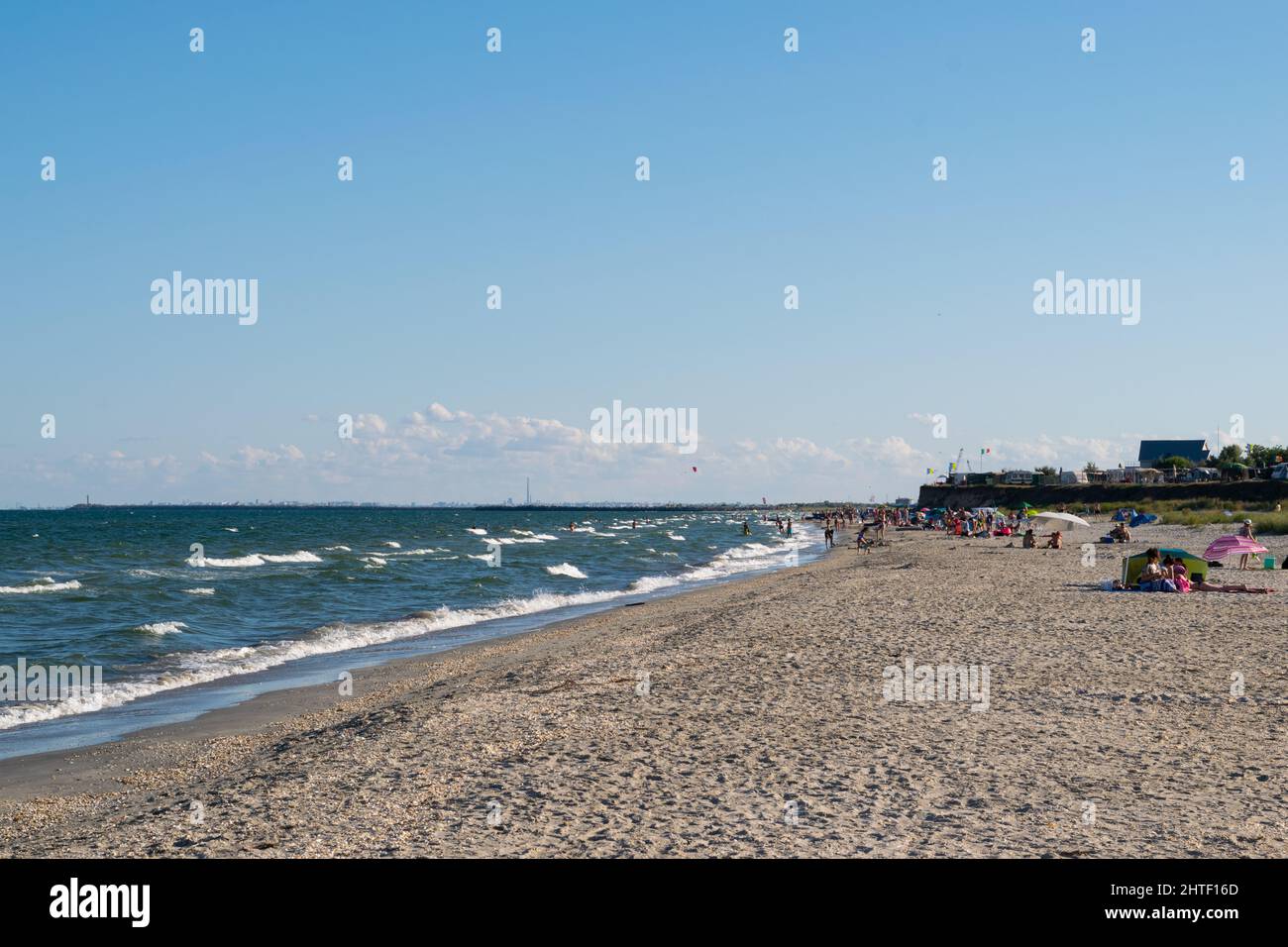 Sunny day and tourists having fun on the beach of Corbu, Romania Stock ...