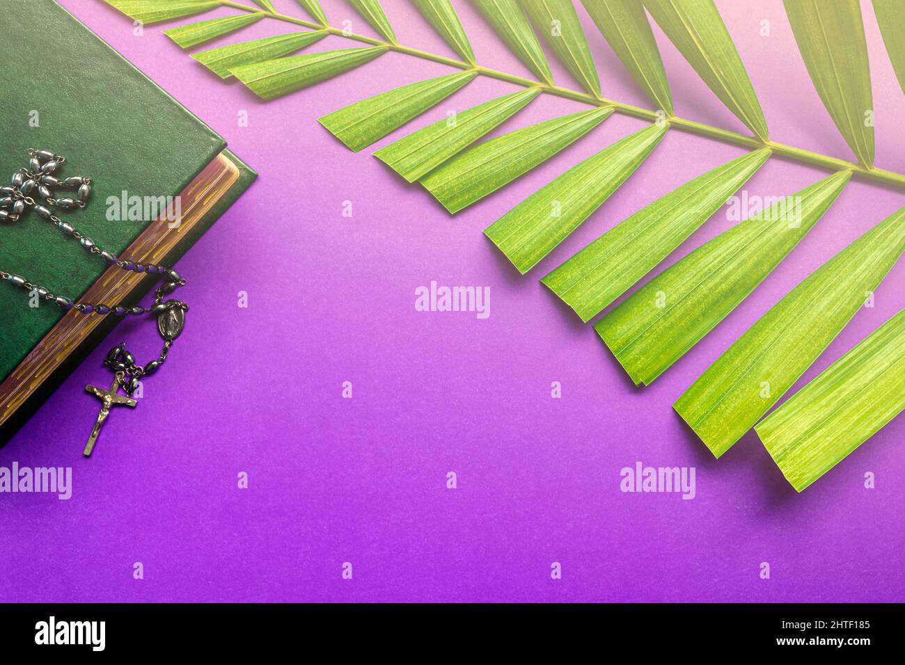 The Holy Bible, cross and palm leaves on purple background. Holy week ...