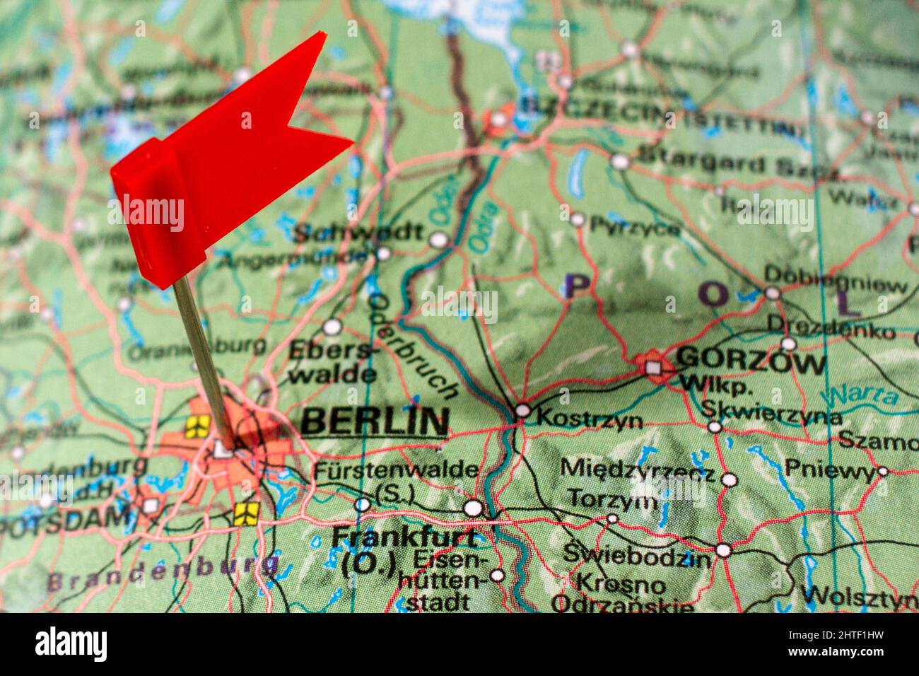 Closeup shot of a red flag in Berlin on the map Stock Photo - Alamy