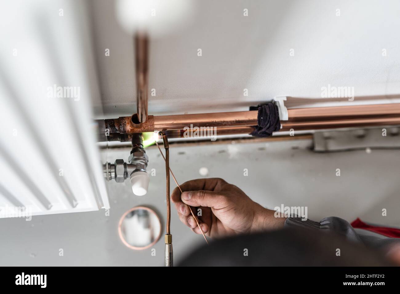 Close up on hands Unknown industrial worker plumber with central ...