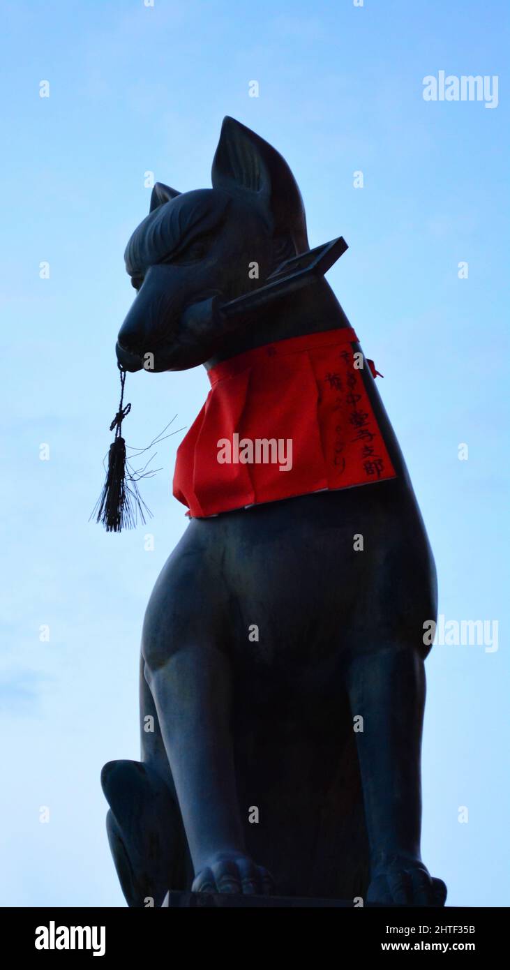 Guardian sculpture of a dog in a Japanese temple in Osaka Stock Photo ...