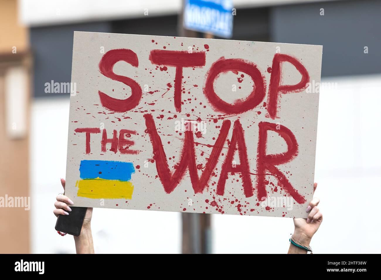 Demonstration against Russia's invasion of Ukraine with signs saying ...