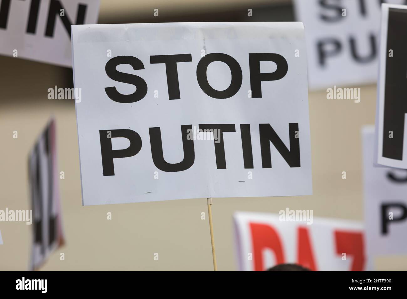Demonstration against Russia's invasion of Ukraine with signs saying ...