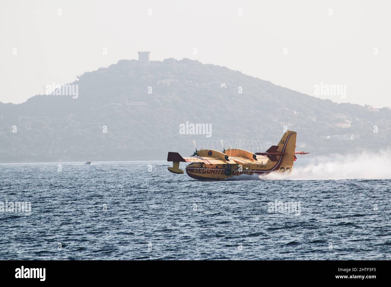 Yellow seaplane landed on the water Stock Photo - Alamy