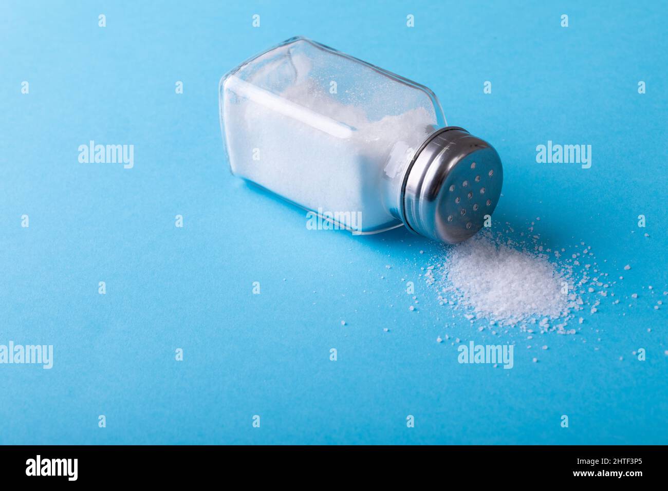 Salt spilling shaker blue hi-res stock photography and images - Alamy