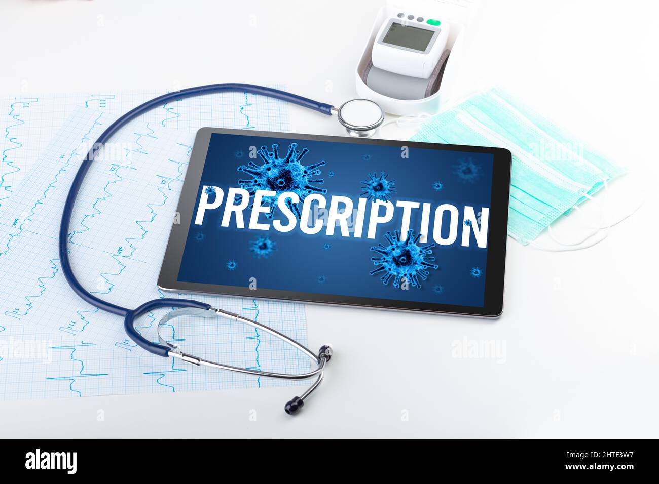 Tablet pc and doctor tools on white surface Stock Photo - Alamy